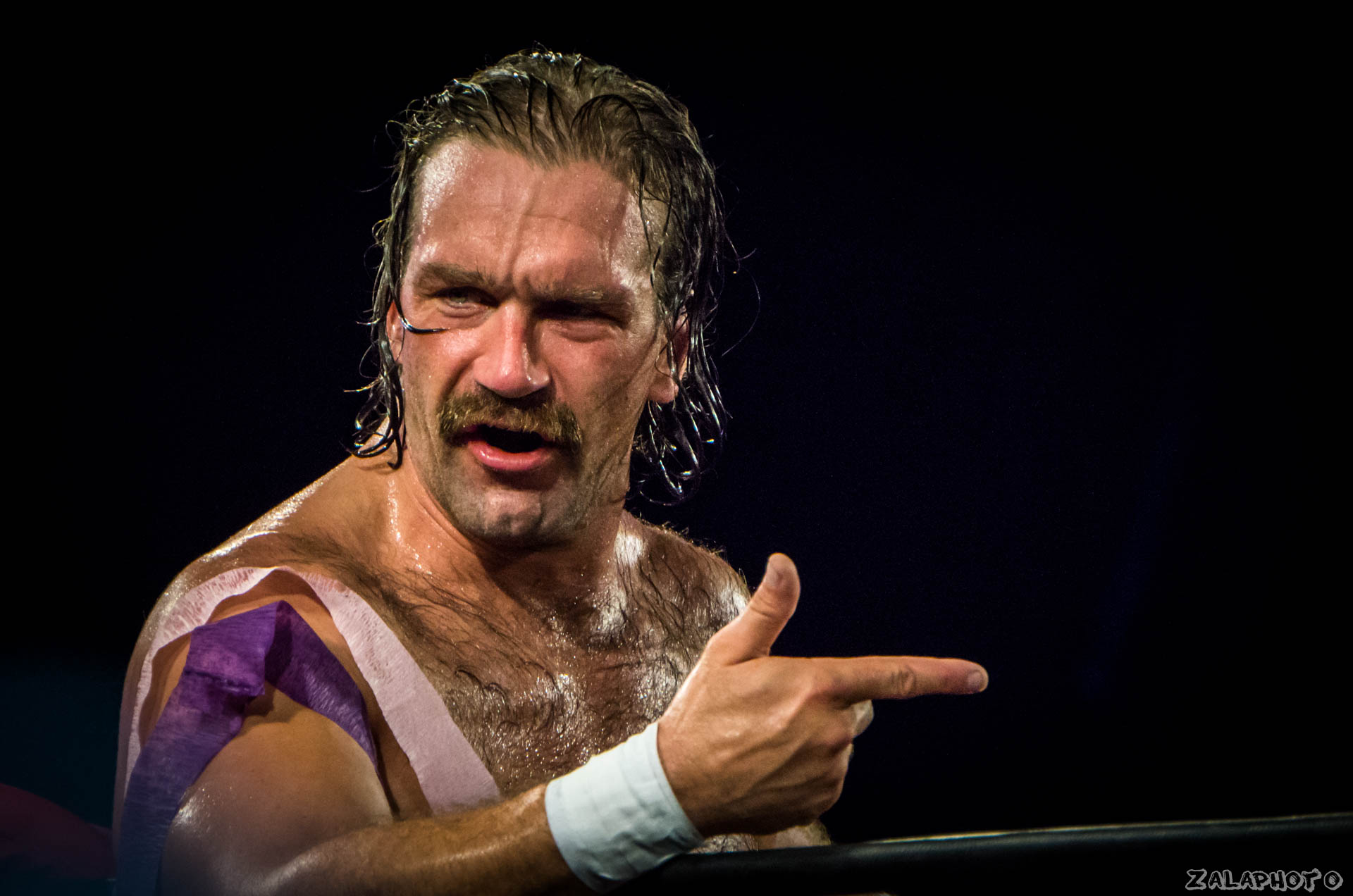 Zalaphoto Wrestling Photography » Silas Young pointing at Dalton Castle